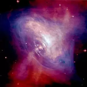 Crab Nebulanyň bu birleşýän şekilinde materiýa we antimateriýa, Crab pulsary tarapyndan ýagtylygyň tizligine diýen ýaly hereket edýär. Suratlar NASA-nyň Chandra rentgen obserwatoriýasyndan we Hubble kosmos teleskopyndan alyndy.